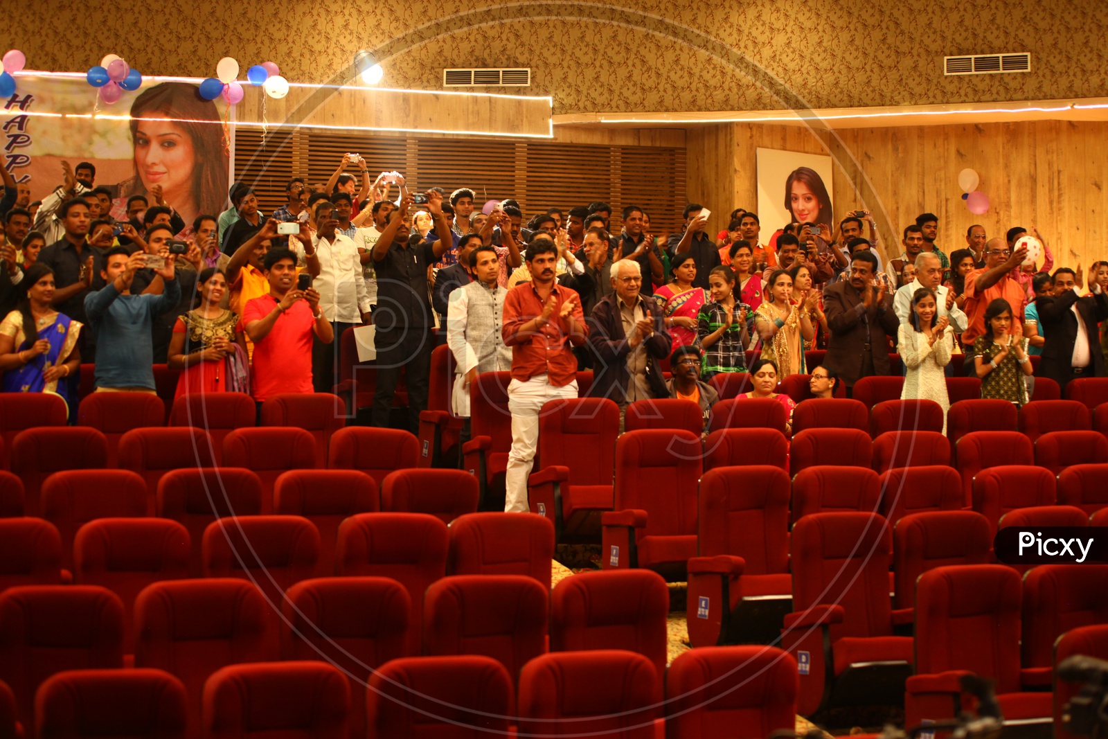 Image of Crowd In an Auditorium Taking Pictures With Their Smart Phones ...