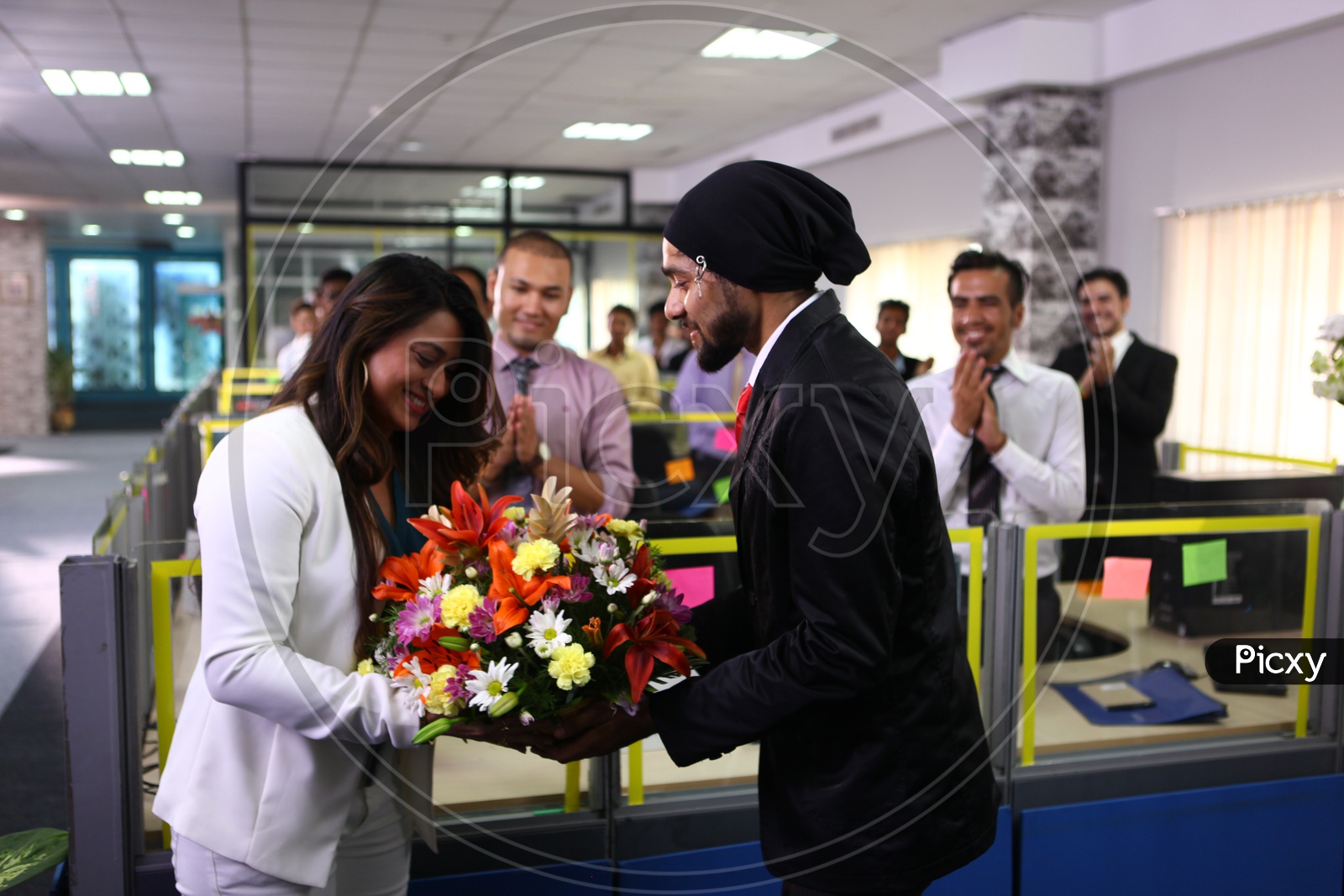 Image of Office Staff Welcoming Young Lady Boss Into Office With a ...