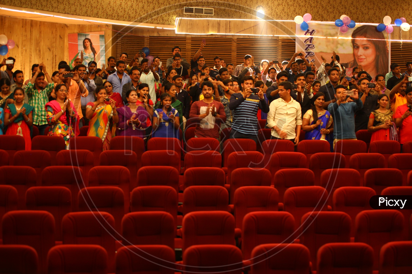 Image of Crowd In an Auditorium Taking Pictures With Their Smart Phones ...