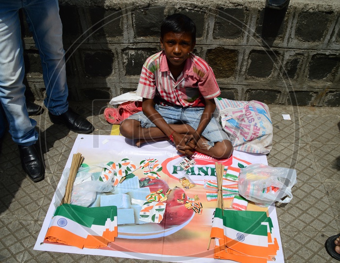 Image of A Boy Vendor Selling Indian National Flags On Independence Day ...