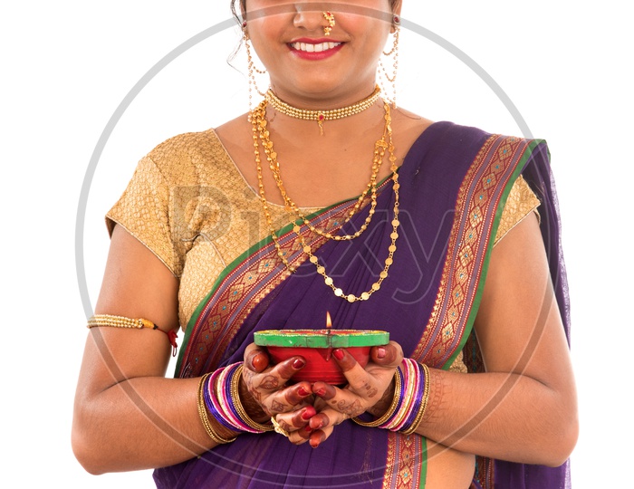 Image of A Traditional Indian Marathi Woman Holding Diwali Diya In Hand ...