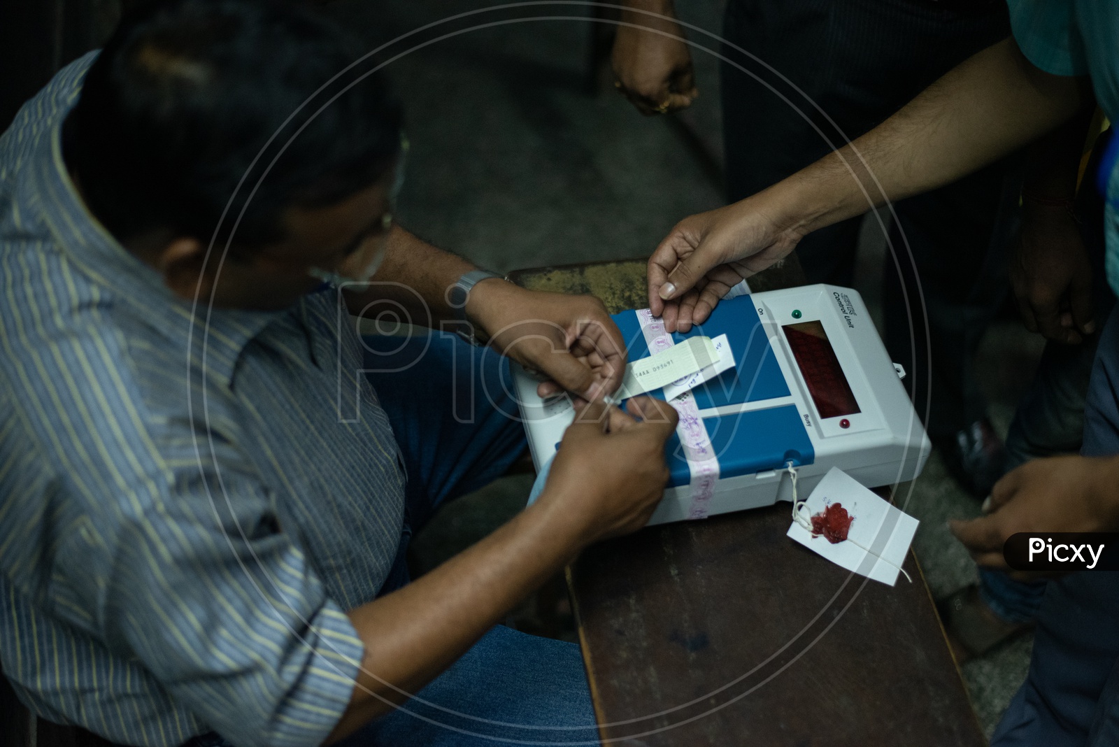 Image of Election Commission Polling Booth Officer Sealing The EVM ...
