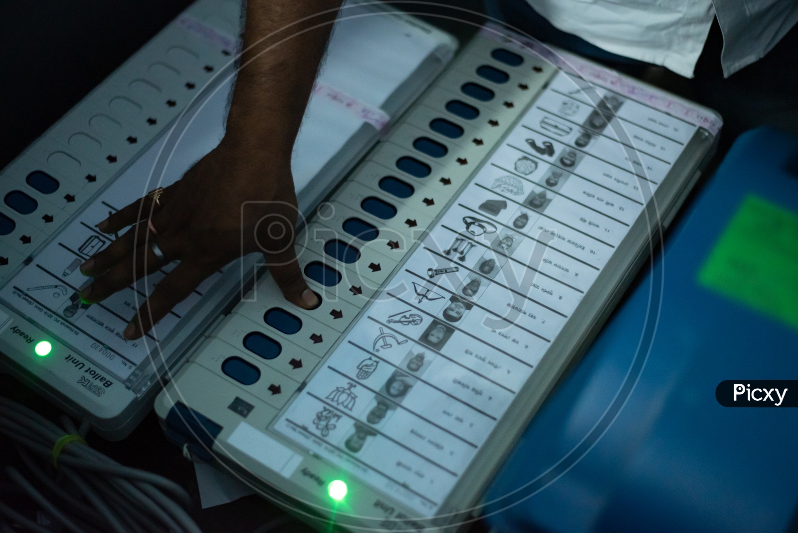 Image Of Voters Using Electronic Voting Machines EVM In A Polling
