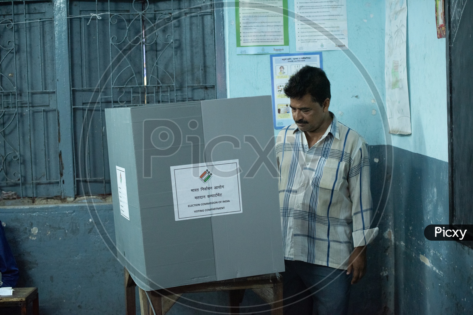 Image of Indian Voters voting In a Polling Booth for Lok Sabha General ...