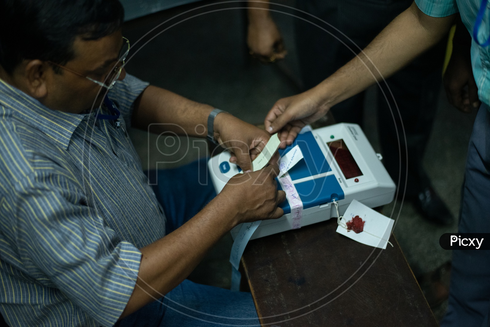 Image of Election Commission Polling Booth Officer Sealing The EVM ...