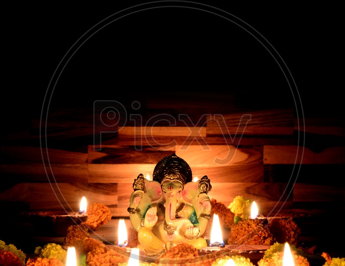 Image of Indian Hindu God Pooja On a Festival With Clay Diwali Diyas ...