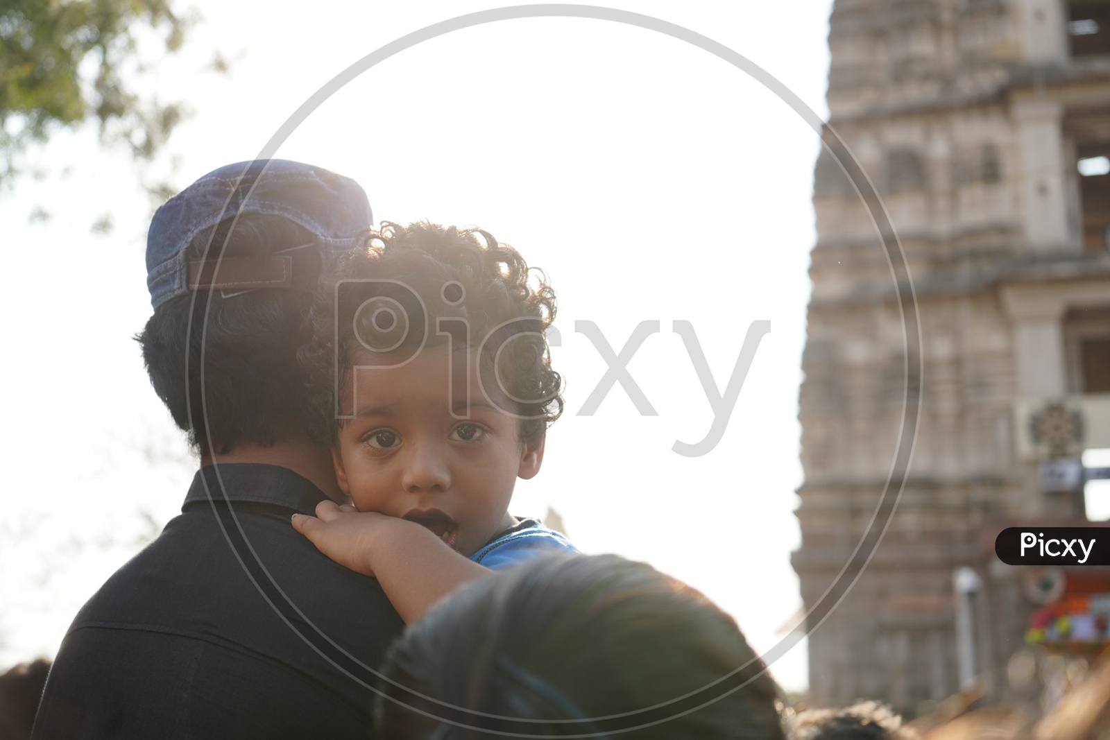 Image of A Father With His Child In a Hindu God Procession-AS023304-Picxy