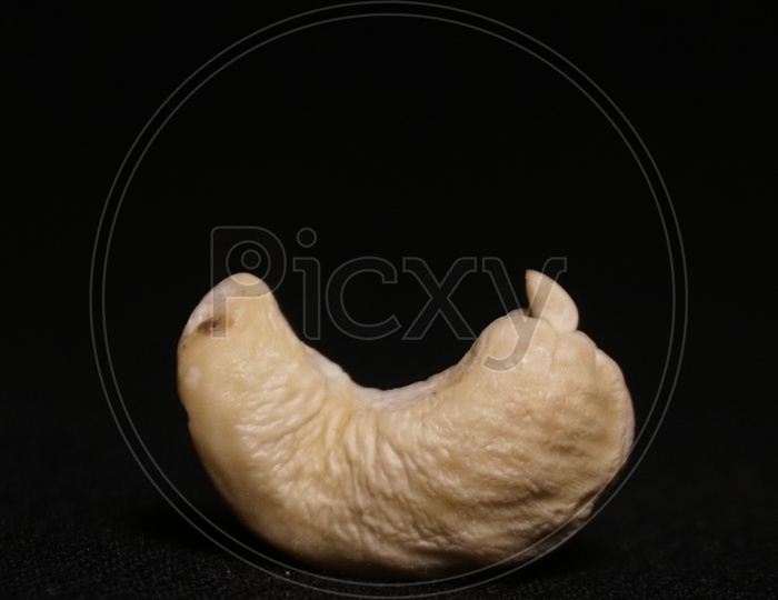 Image of A Single Cashew Nut or Cashew On an isolated Black Background ...