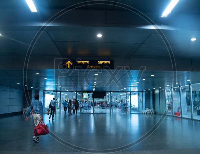 Image of Airport Arrival Gate With Passengers Coming From The Gate ...