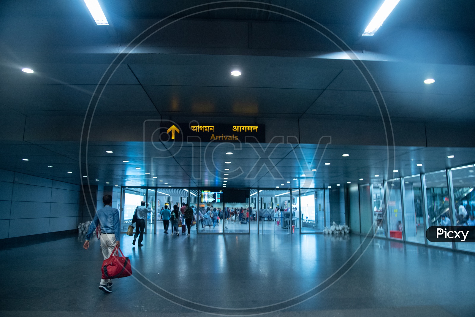 Image of Airport Arrival Gate With Passengers Coming From The Gate ...