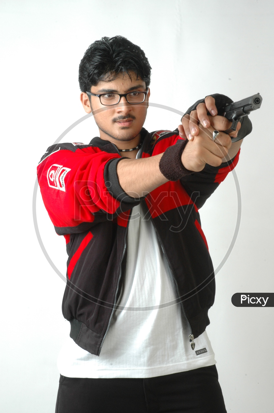 Image of A Young Indian Man Holding Gun or Pistol And Posing On an ...