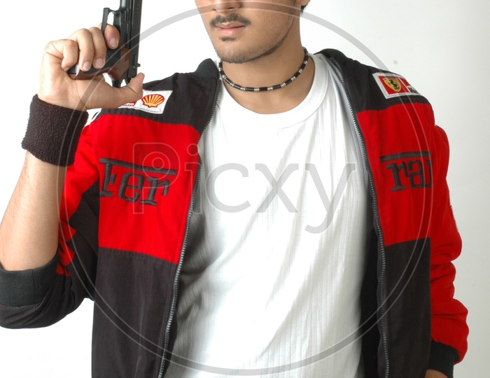 Image of A Young Indian Man Holding Gun or Pistol And Posing On an ...