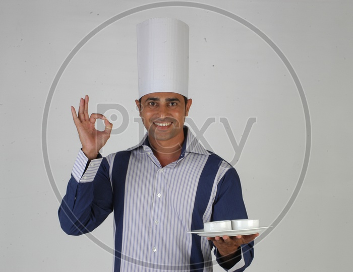 Image of An Indian Chef With Soup Bowls And With an Expression on An ...