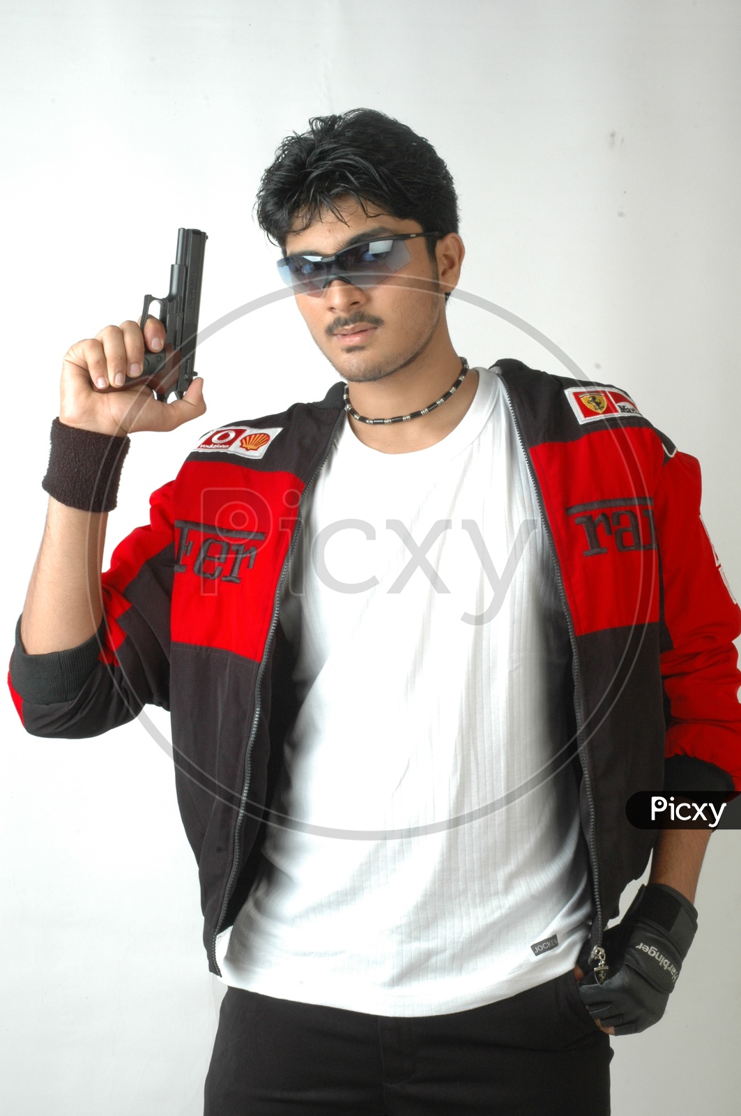 Image of A Young Indian Man Holding Gun or Pistol And Posing On an ...