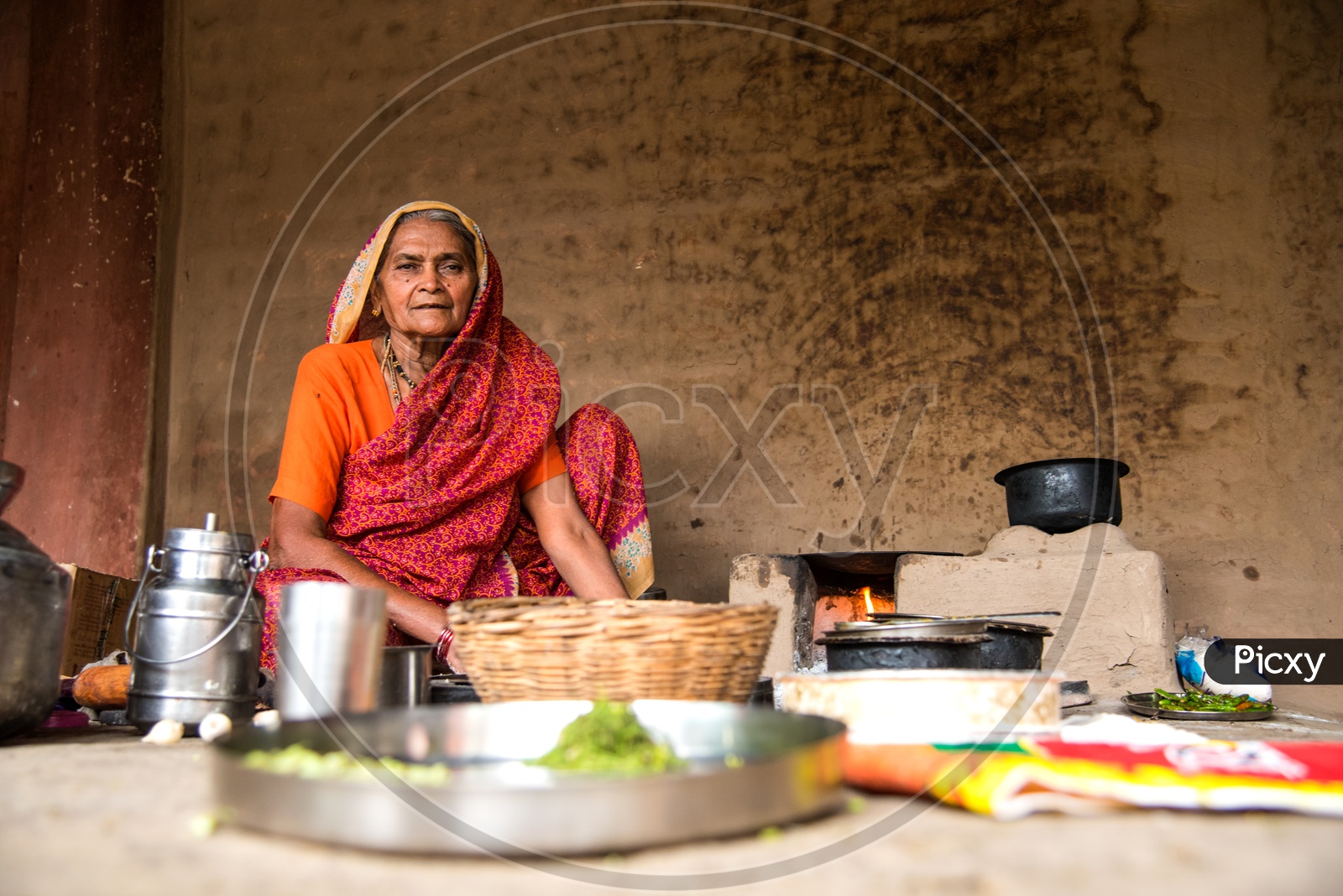 Image of An Indian Old Woman Making Or Cooking Food In an Ancient Or ...