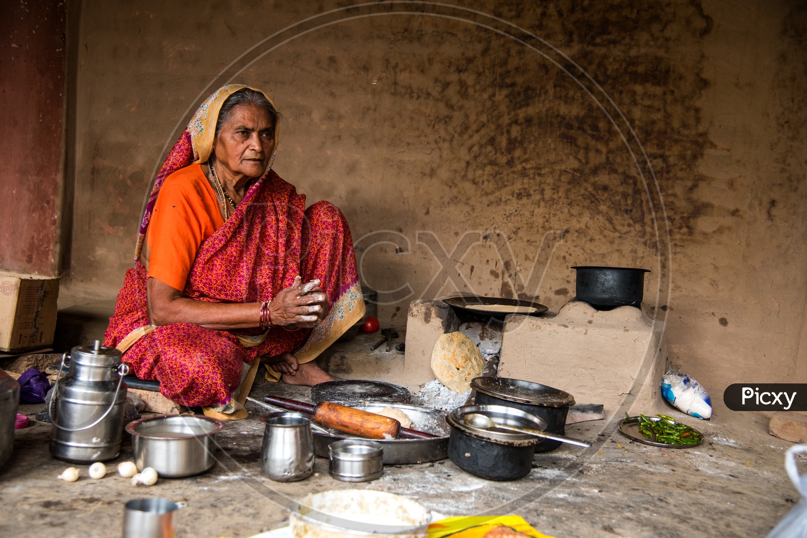 Image of An Indian Old Woman Making Or Cooking Food In an Ancient Or ...
