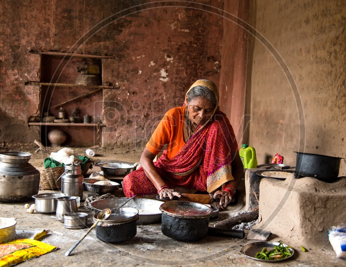 Image of An Indian Old Woman Making Or Cooking Food In an Ancient Or ...