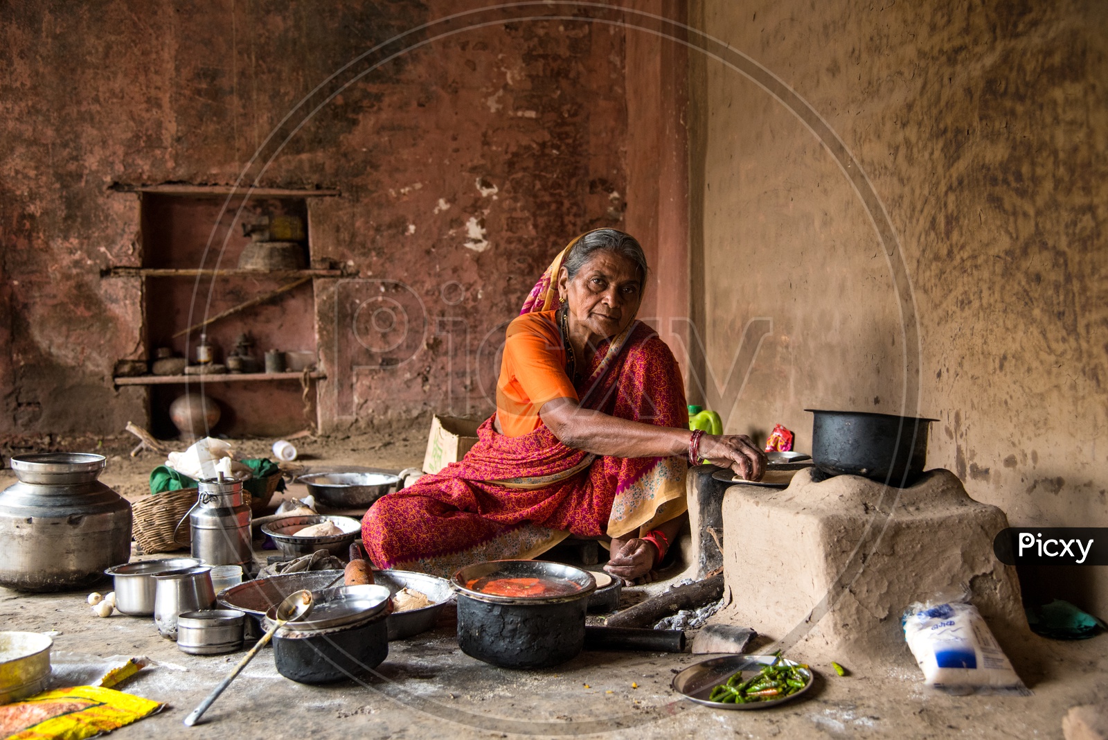 Image of An Indian Old Woman Making Or Cooking Food In an Ancient Or ...