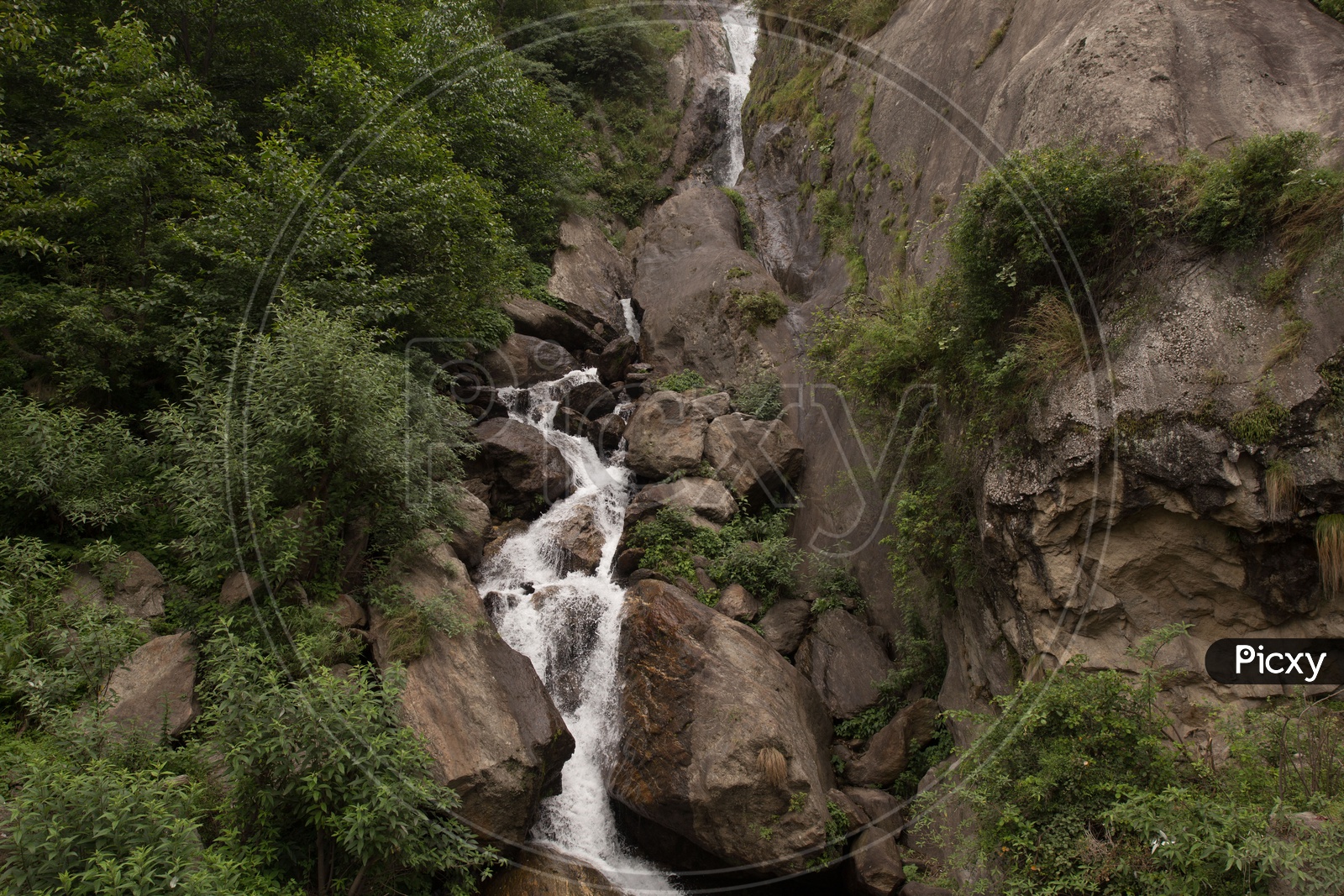 Image of Water Falling From Hill Top and Through Stones in a Valley ...