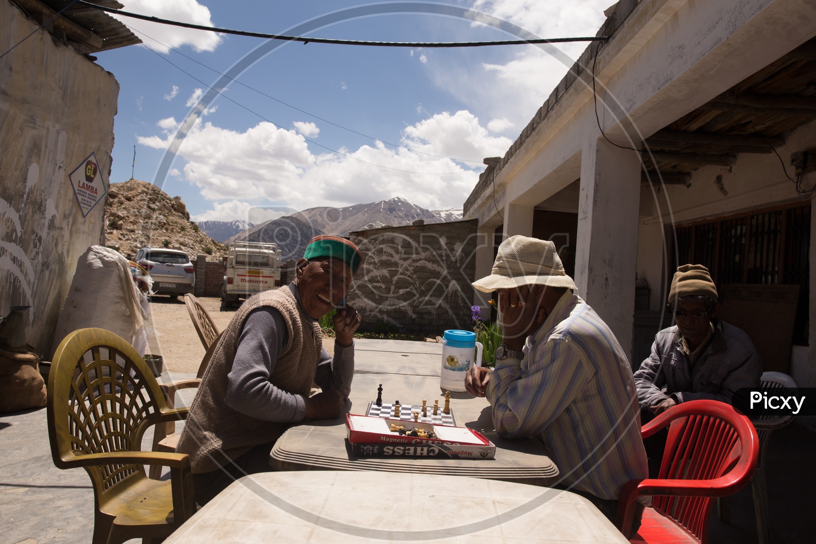 Image of Villagers Playing Chess By Sitting At a Eatery Shop In A ...