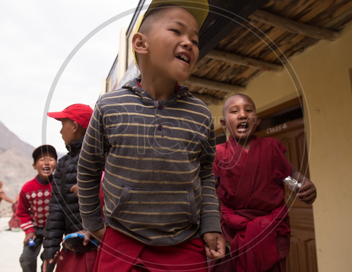 Image of Buddhist Monk Children In red Dress Attire at The Buddhist ...