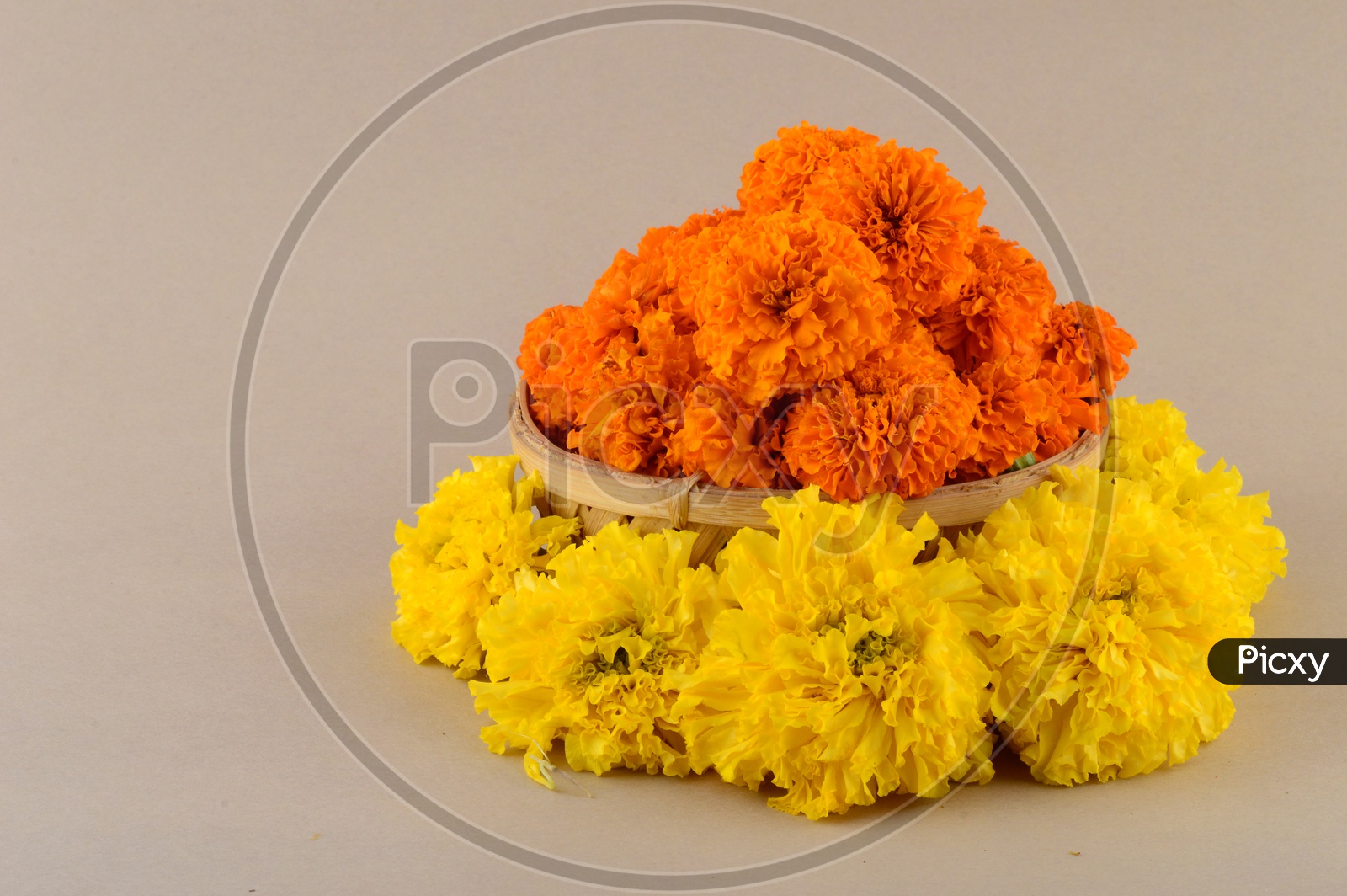 Image of Mari Gold Flowers in a Wooden Weaved Basket For Hindu God ...