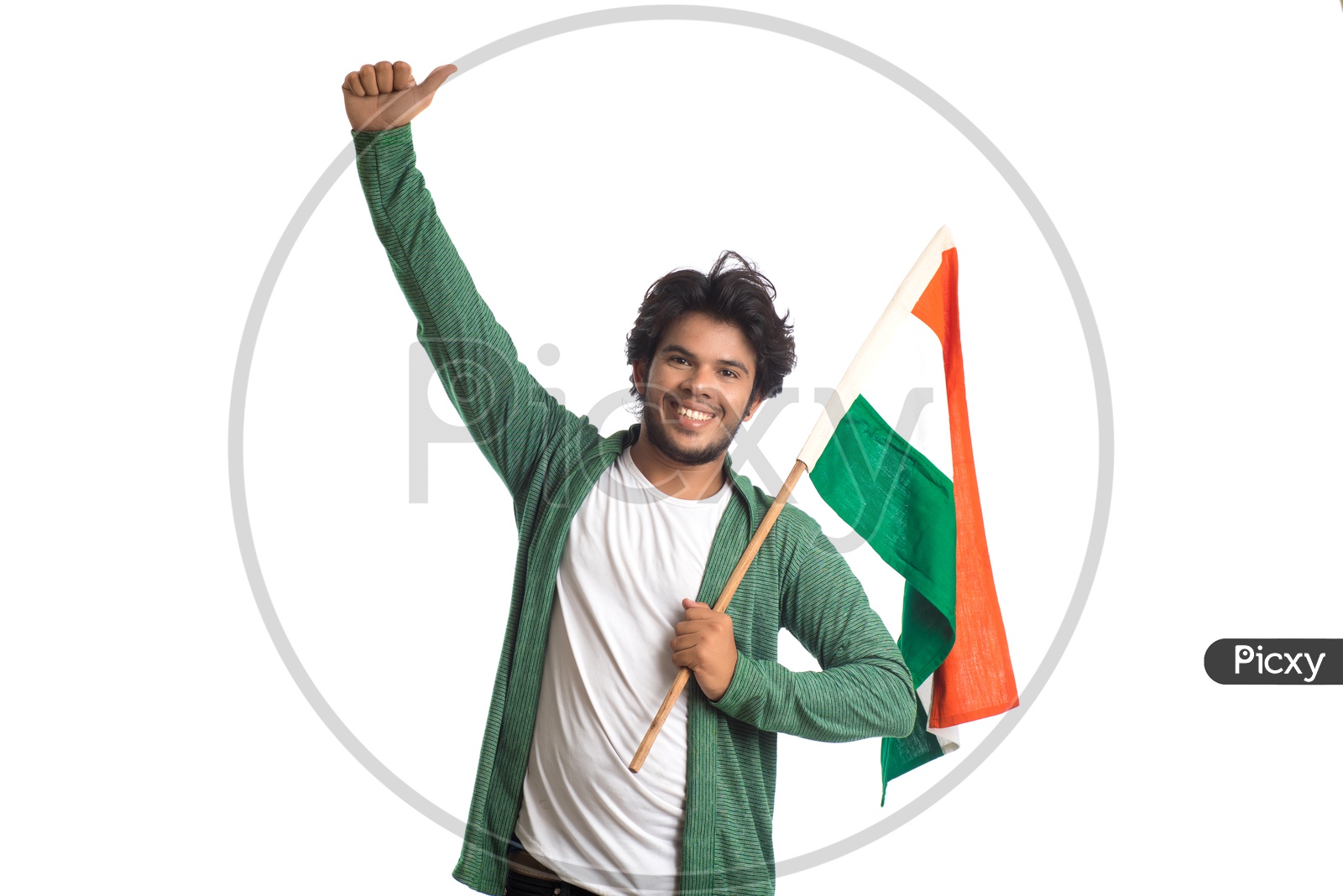 Image of A Young Indian man Holding Indian National Flag ( Tri Color ...