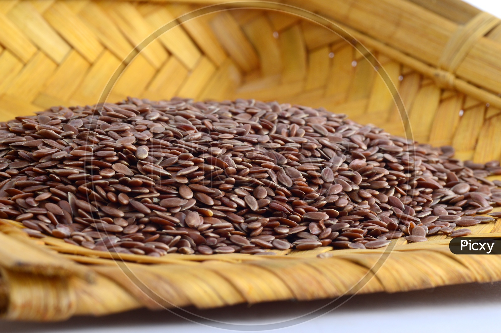 Image of Flax seeds in winnowing basket-HQ158139-Picxy