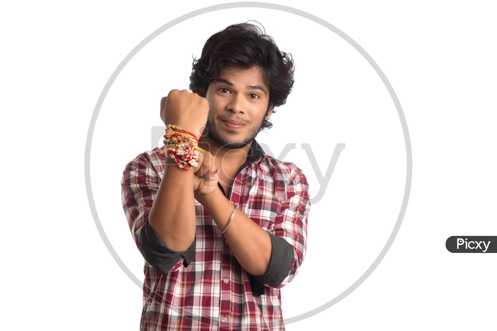 Image of A Young Indian Man Holding Elegant Rakhis In Hand Posing Over ...