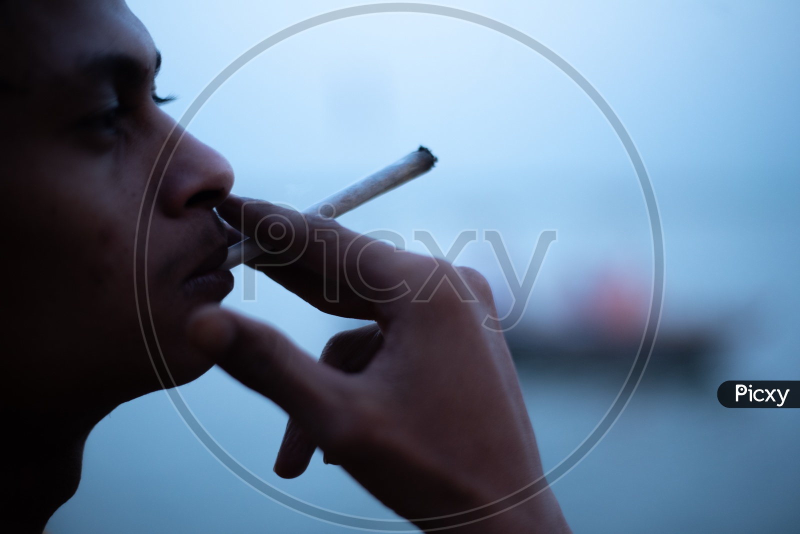 Image of A Man Smoking Joint Or Ganja Or Marijuna Or Weed Cigar Closeup ...