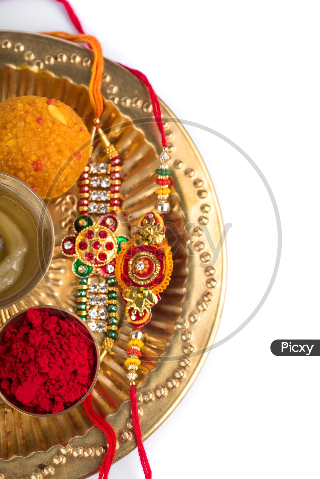 Image of An Elegant Rakhi On an Pooja Thali With Rice Grains,Kumkum ...