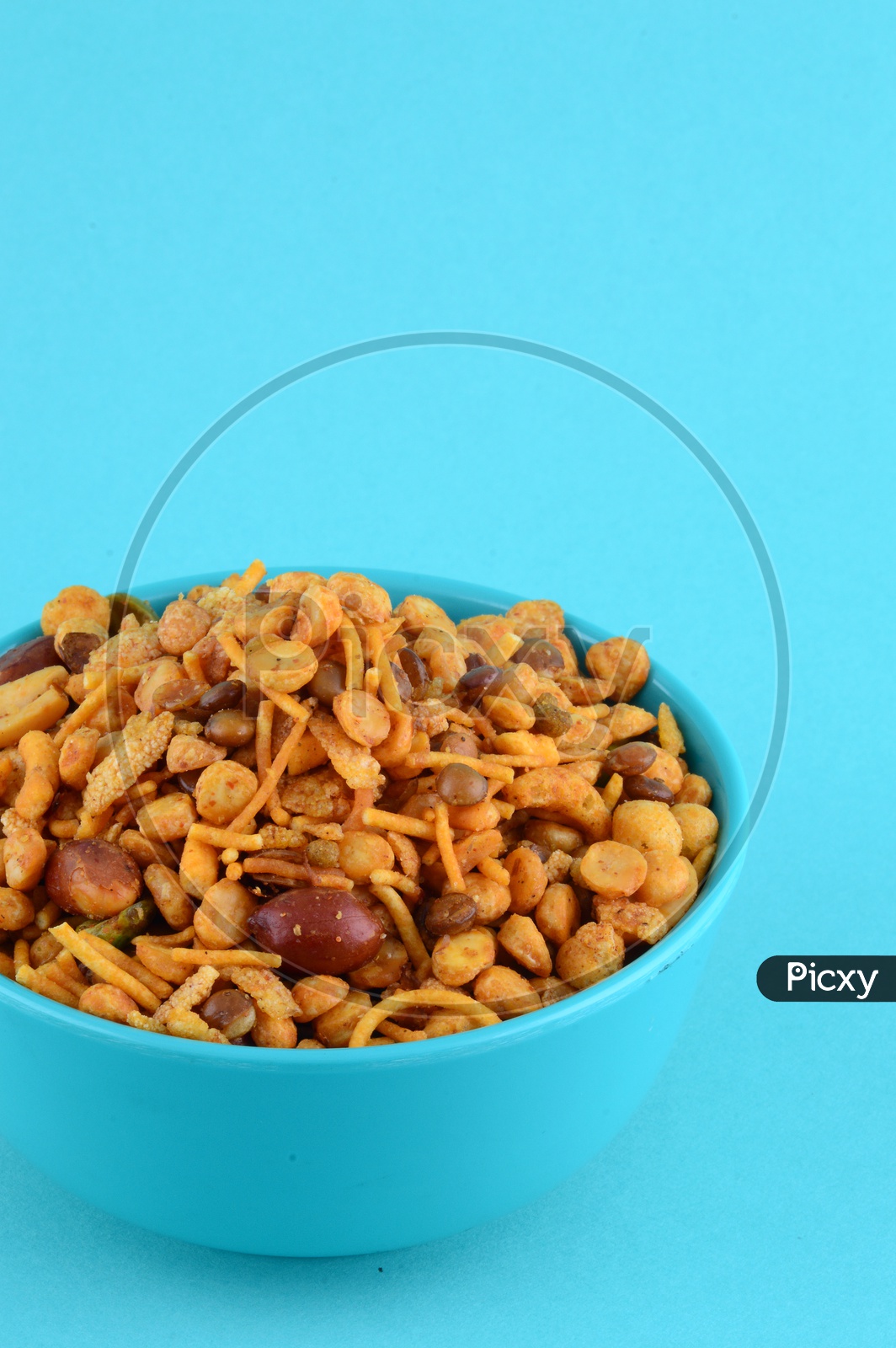 Image of Indian Snack , Salty Deep Fried Chivda Or Mixture In a Blue ...