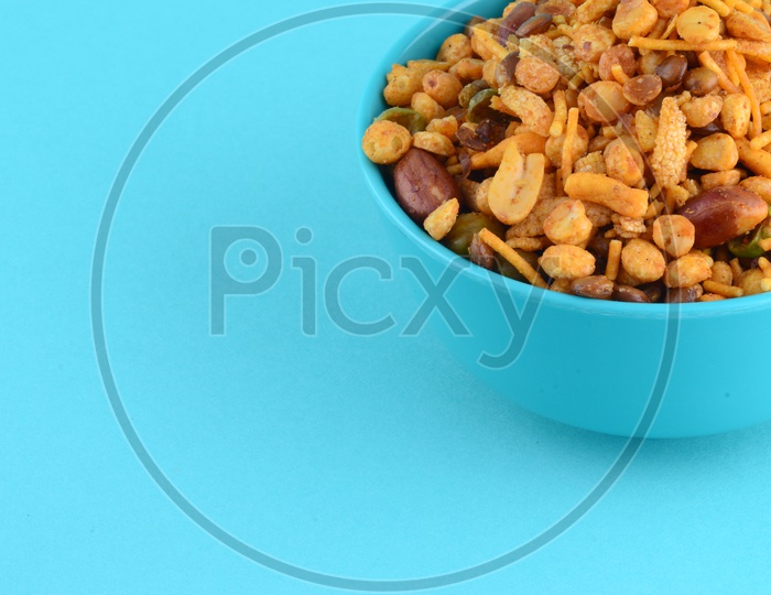 Image of Indian Snack , Salty Deep Fried Chivda Or Mixture In a Blue ...