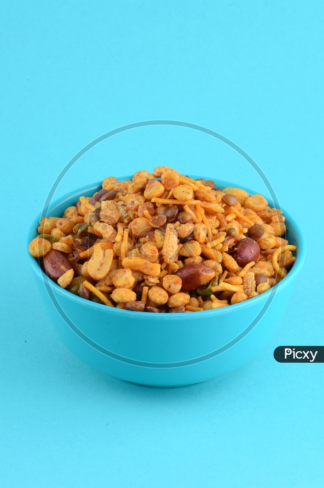 Image of Indian Snack , Salty Deep Fried Chivda Or Mixture In a Blue ...