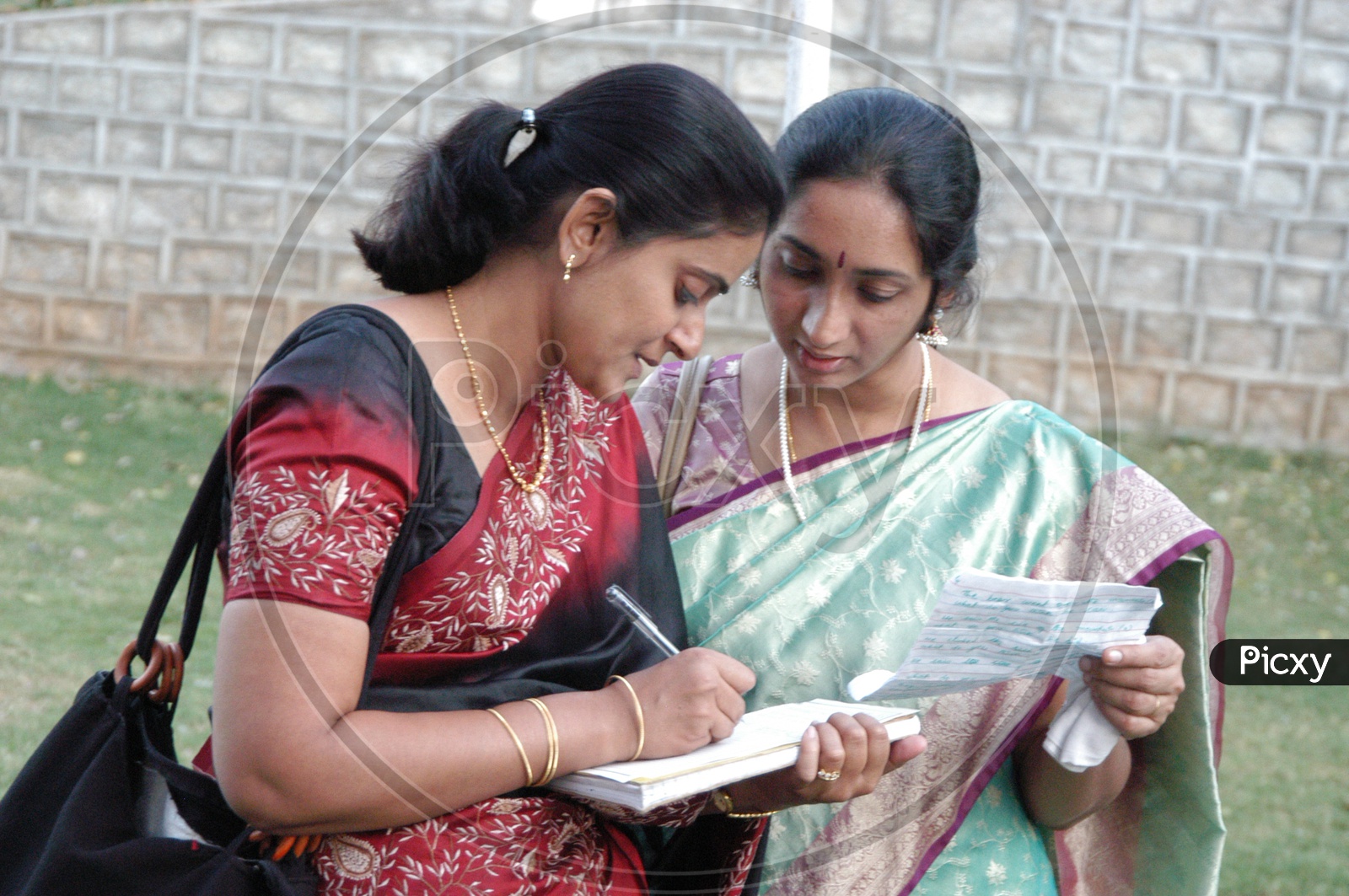 Image of Couple Of Ladies Or Teachers in a Discussion-DJ646397-Picxy