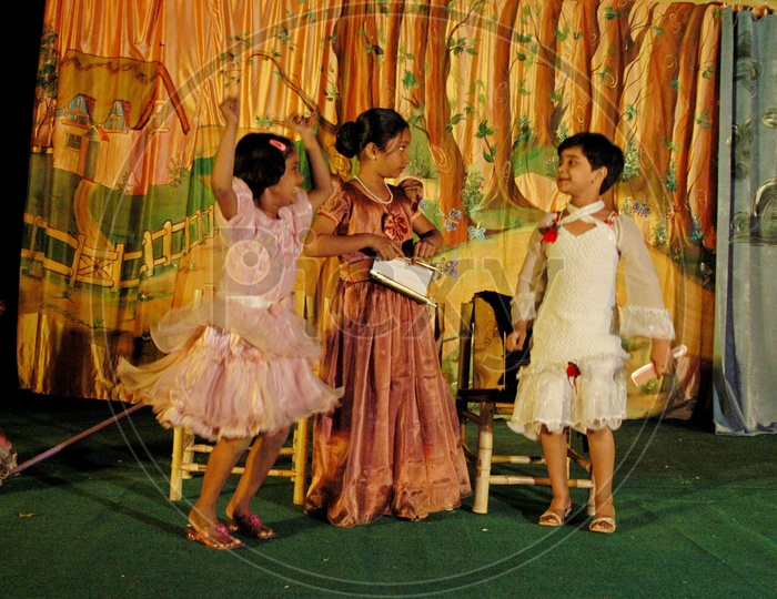 Image of Children Or School Students Performing On Stage Wearing Fancy ...