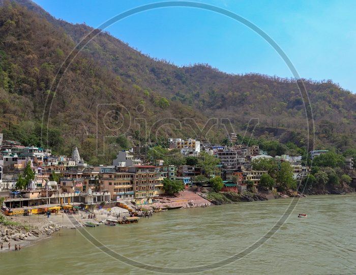 Image of Hindu temples and buildings on the banks of River Ganges ...