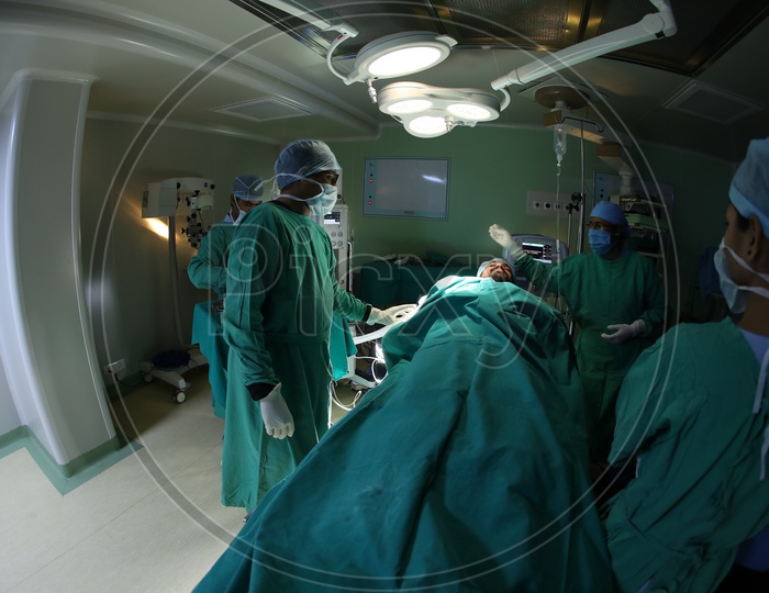 Image of Doctor Treating Patient In Operation Theater or ICU in a ...