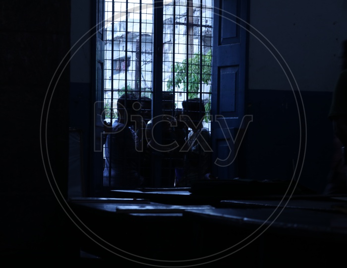 Image of Silhouette Of a People Standing at a Window Opening-BU917044-Picxy