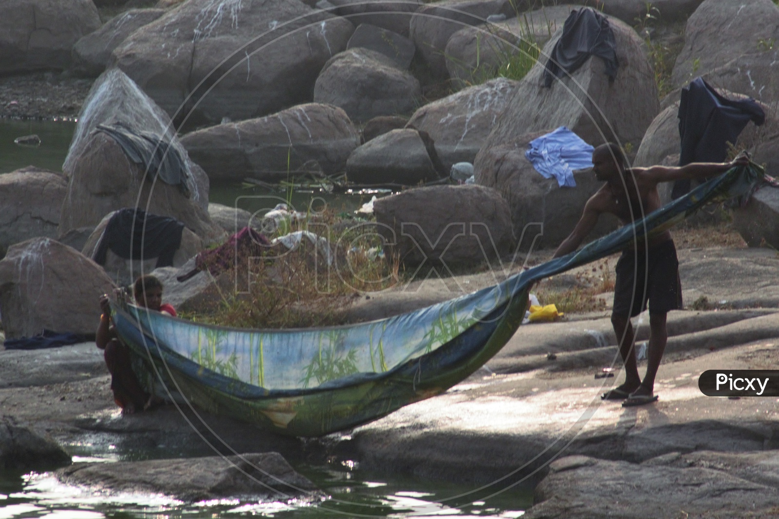 Image of Washer Man or Dhobi Or Rajak Washing Clothes in a Pond Water ...