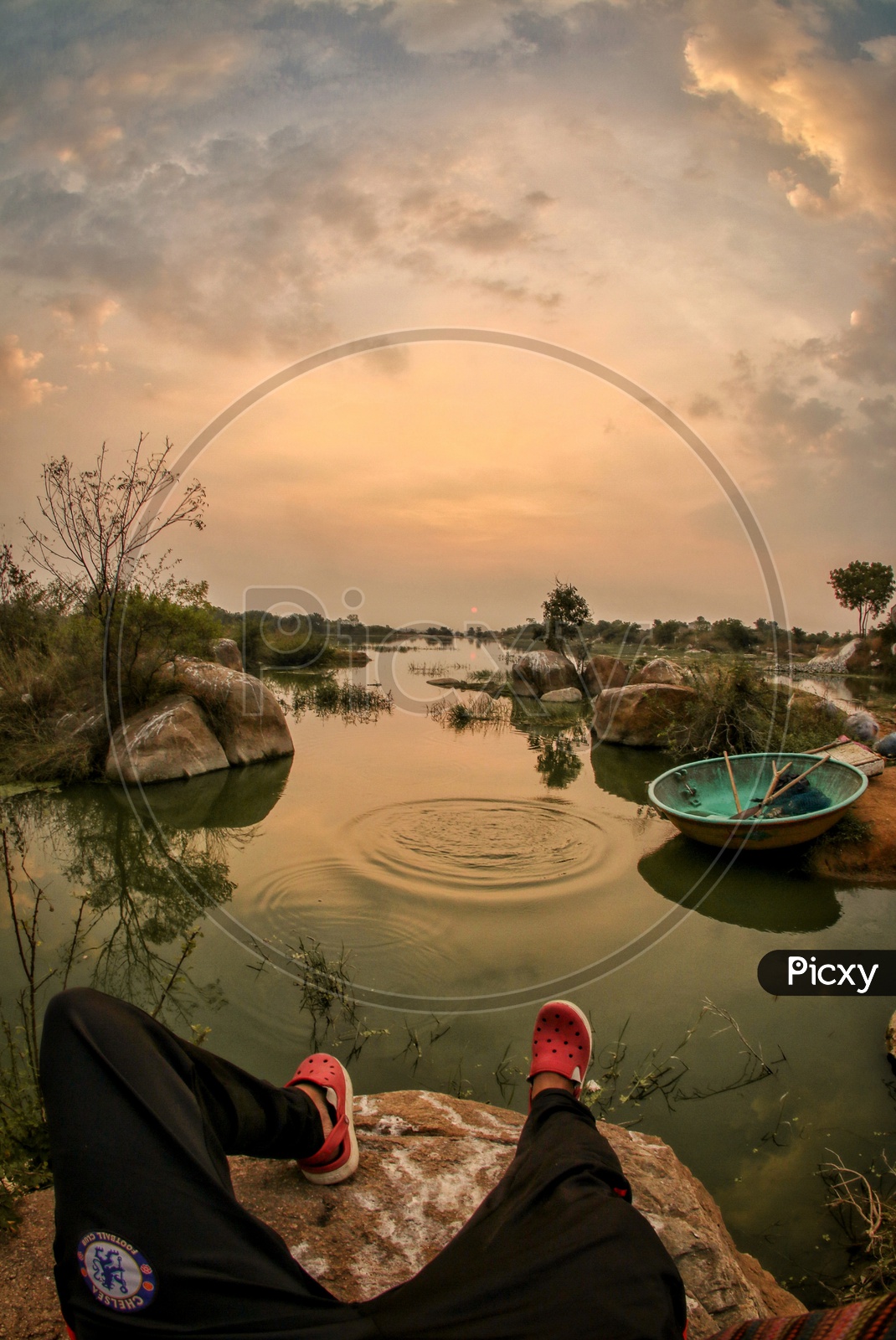 Image of Coracle Boats In a Lake Water With Sunset Sky In Background ...