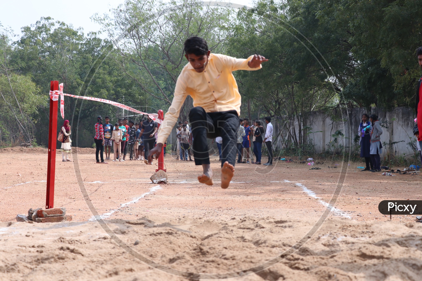 Image of Indian Young School Boys Participating In a Long Jump ...