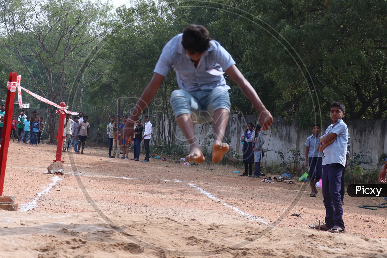 Image of Indian Young School Boys Participating In a Long Jump ...