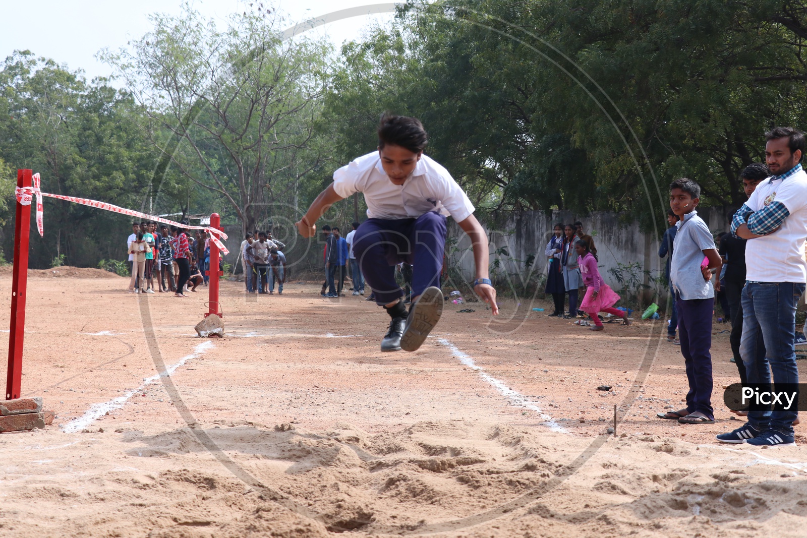 Image of Indian Young School Boys Participating In a Long Jump ...