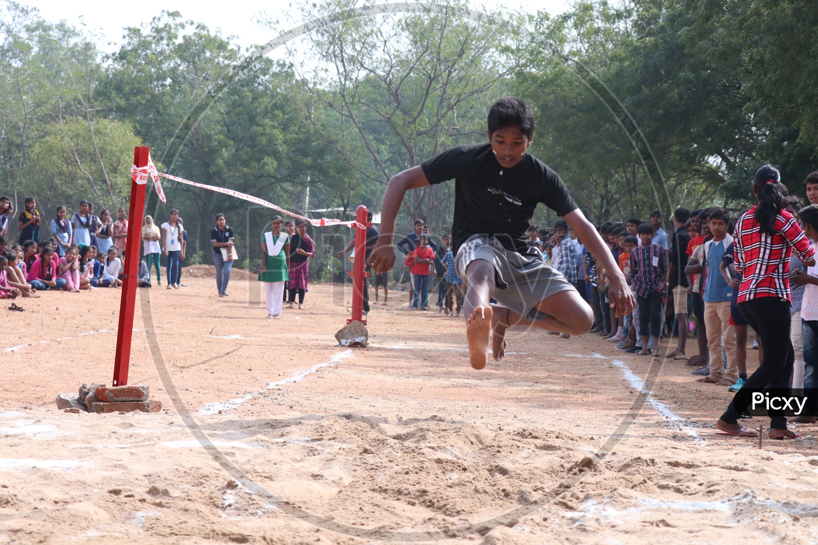 Image of Indian School Students Or Children Participating In Long Jump ...