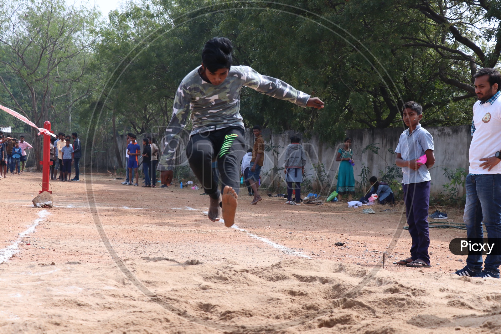 Image of Indian Young School Boys Participating In a Long Jump ...