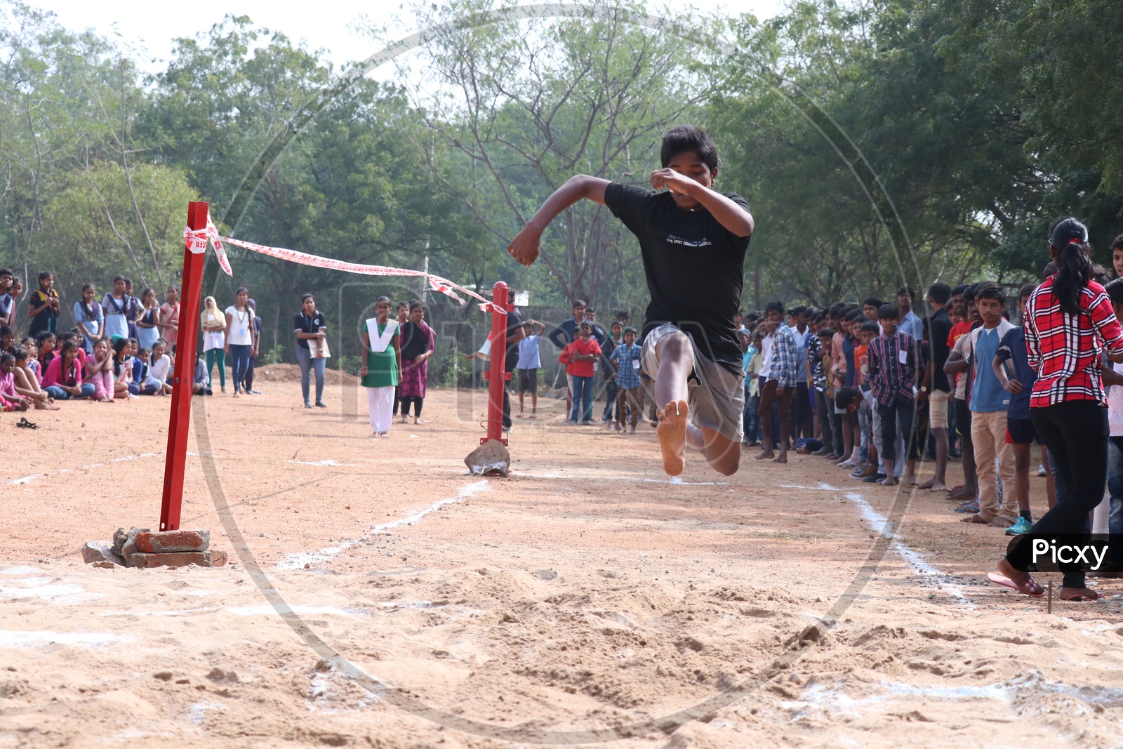 Image of Indian School Students Or Children Participating In Long Jump ...