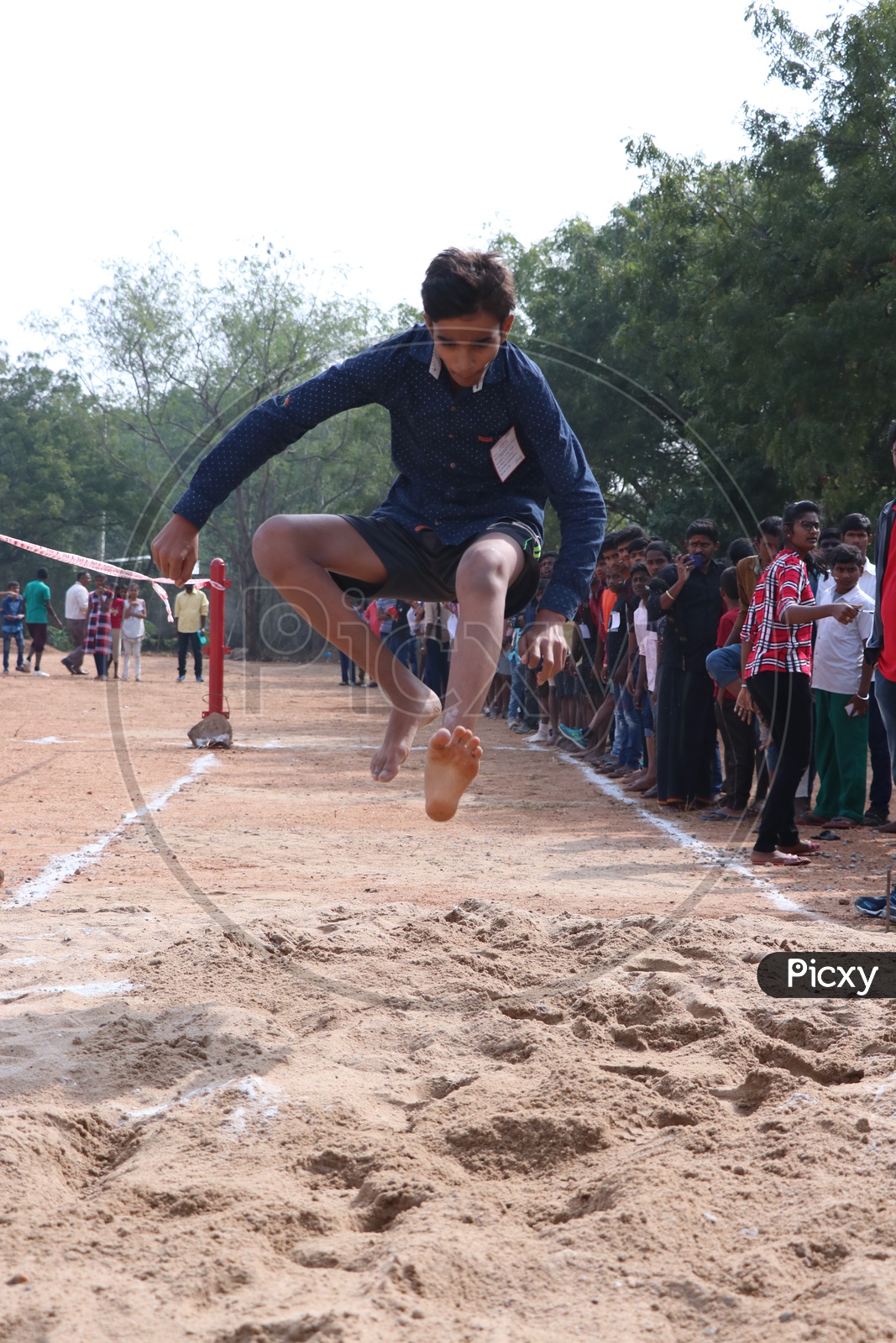 Image of Indian School Students Or Children Participating In Long Jump ...