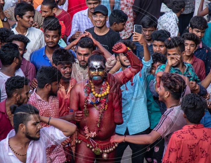 Image of Pothuraju Being Beating And Dancing Along The Crowd With Red ...