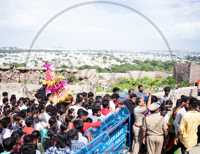 Image of Police man Controlling The crowd Of Devotees At Golconda Fort ...